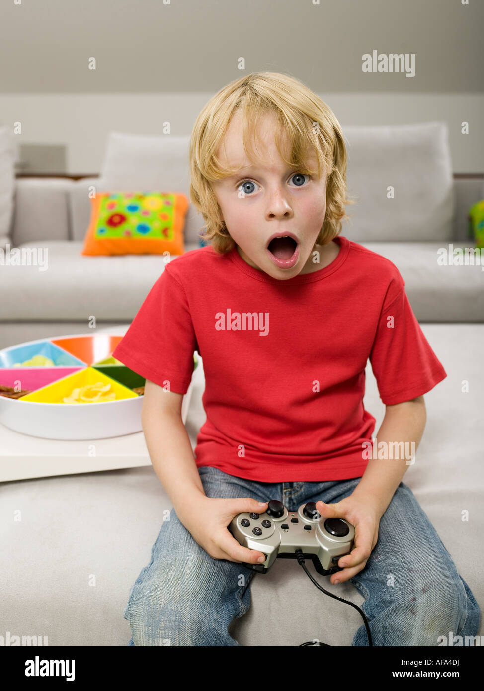 Boy playing computer game Stock Photo - Alamy