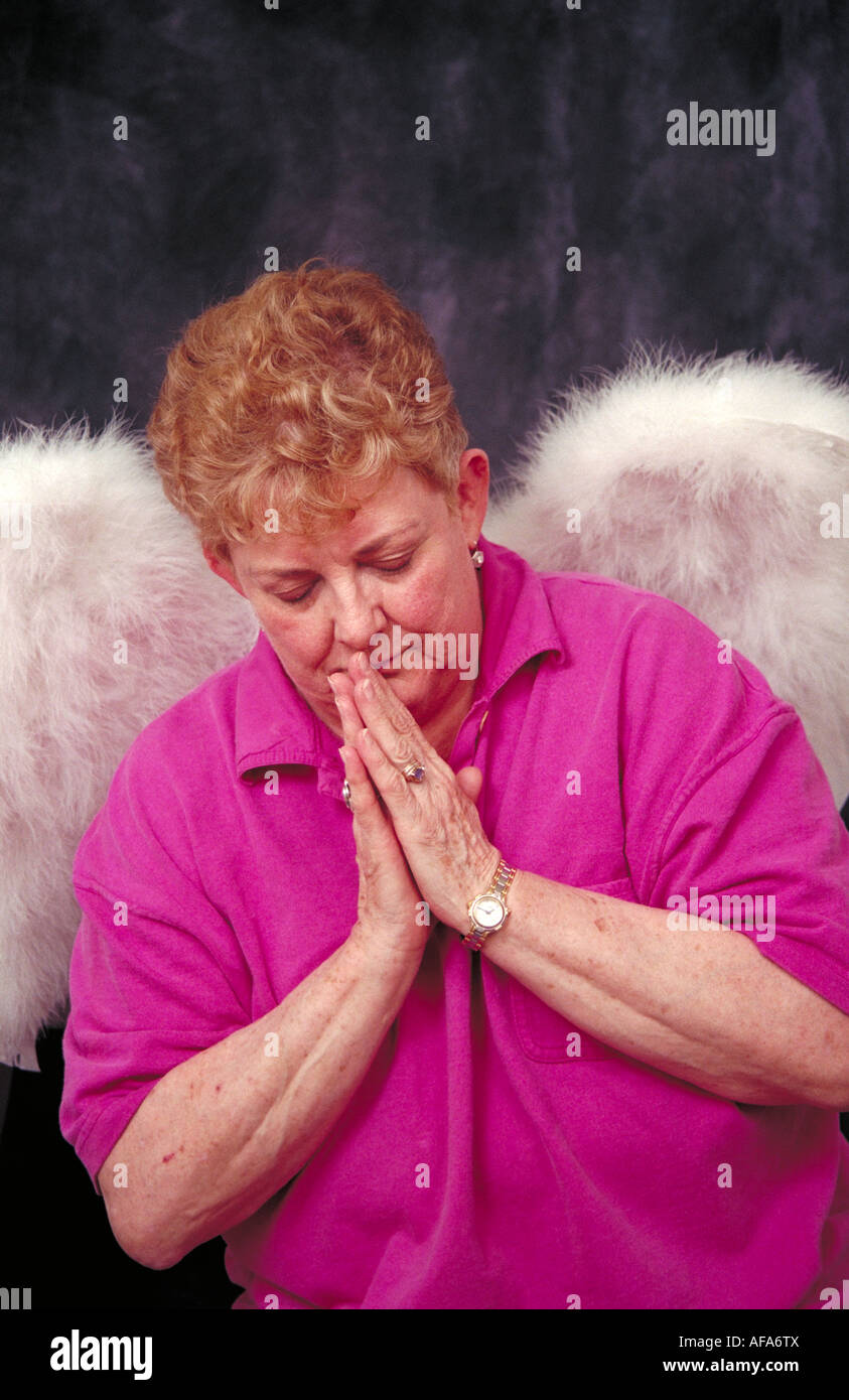 Senior angel praying. St. Paul, Minnesota Stock Photo - Alamy