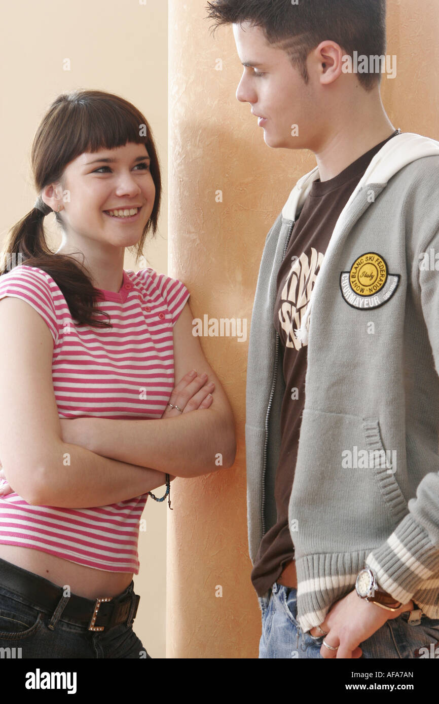 Talking teenage couple Stock Photo - Alamy
