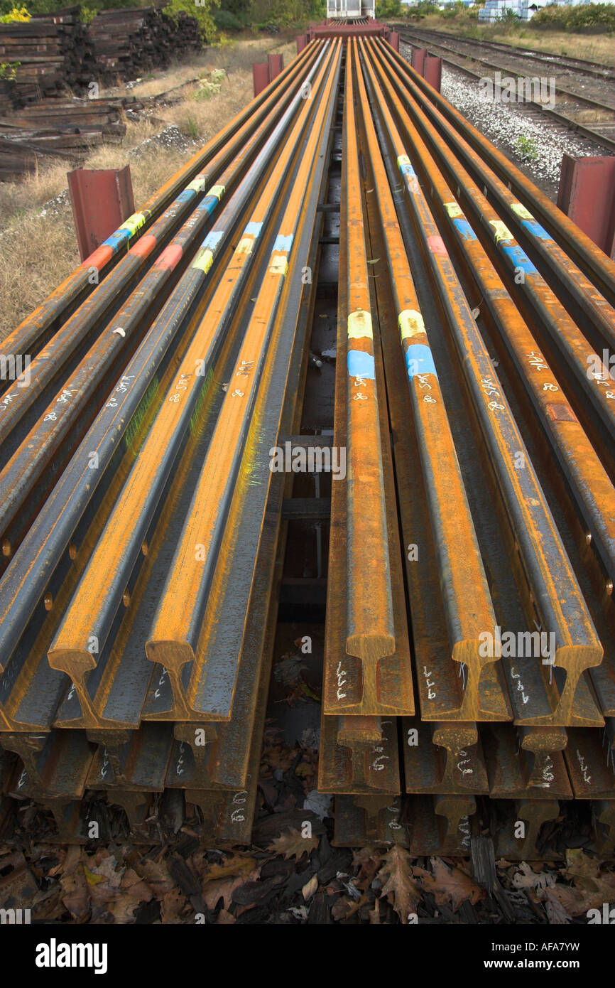 A railcar loaded with rails awaiting shipment Stock Photo - Alamy