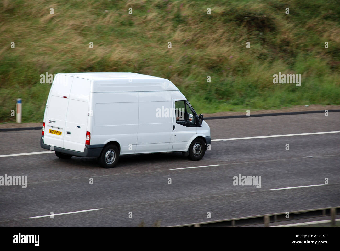 large white transit van on the M62 motorway in Huddersfield Stock Photo ...