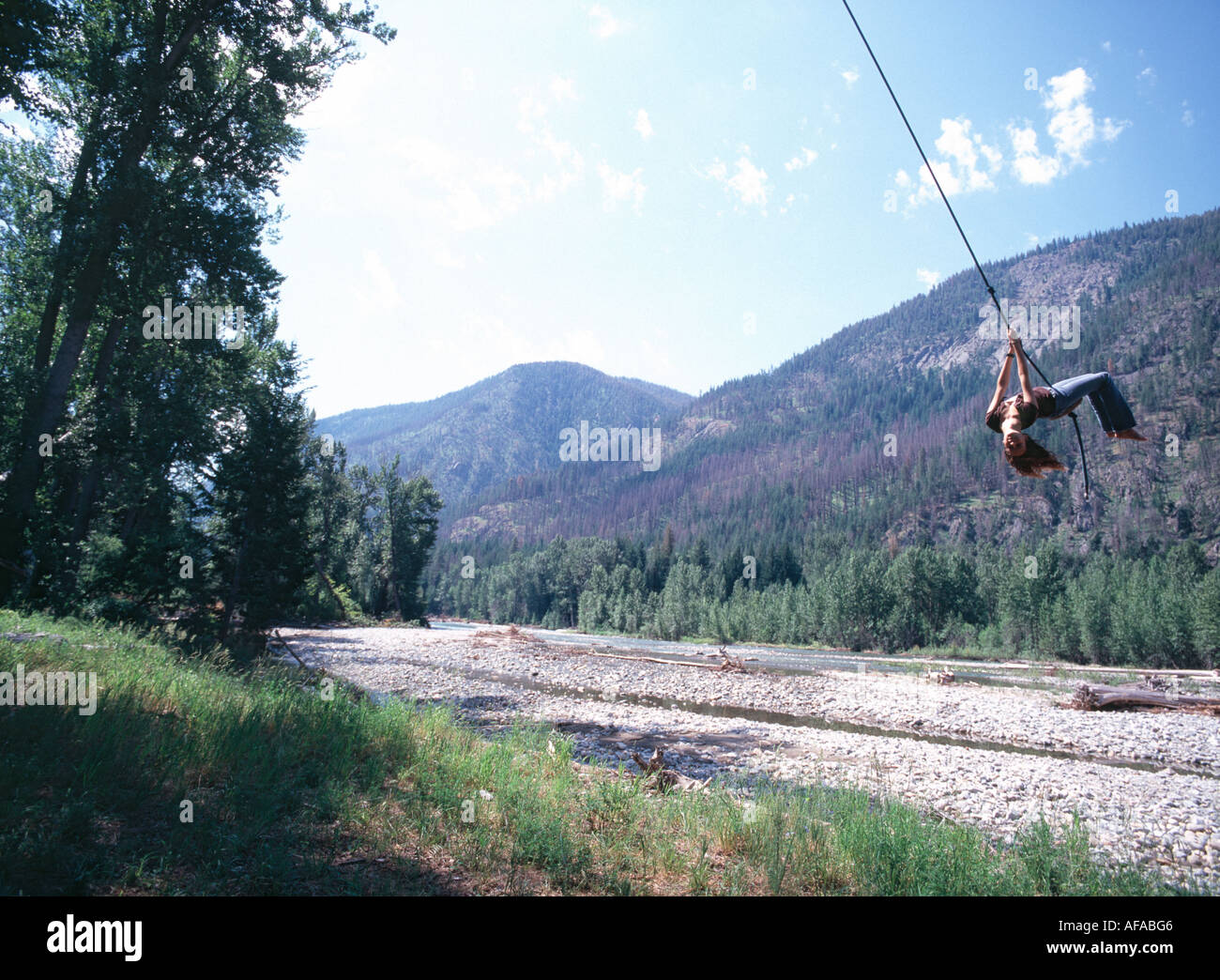 Girl upside down swing hi-res stock photography and images - Alamy