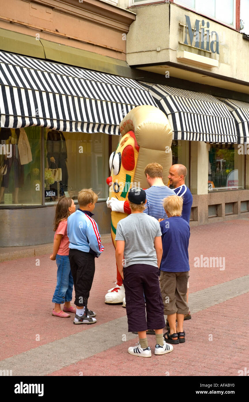 A family with a mascot Stock Photo - Alamy