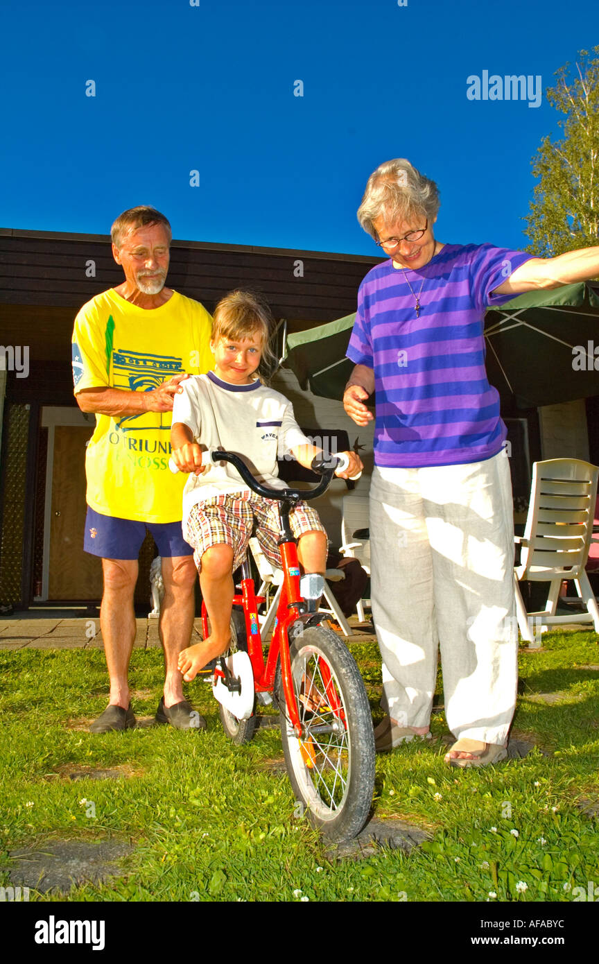Learning to ride a bicycle Stock Photo - Alamy