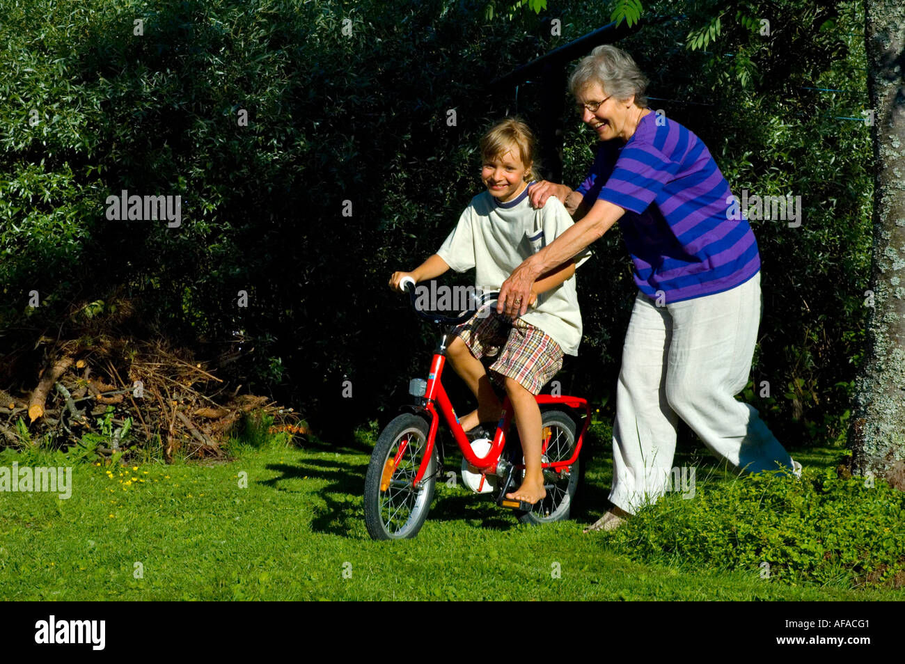Learning to ride a bicycle Stock Photo - Alamy