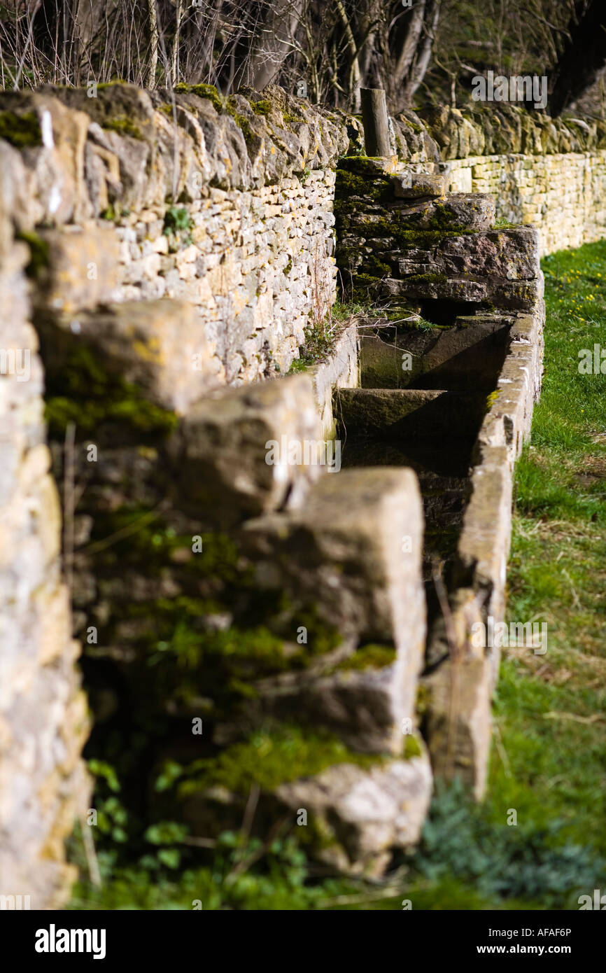Restored medieval stone trough for livestock Hampnett Gloucestershire ...