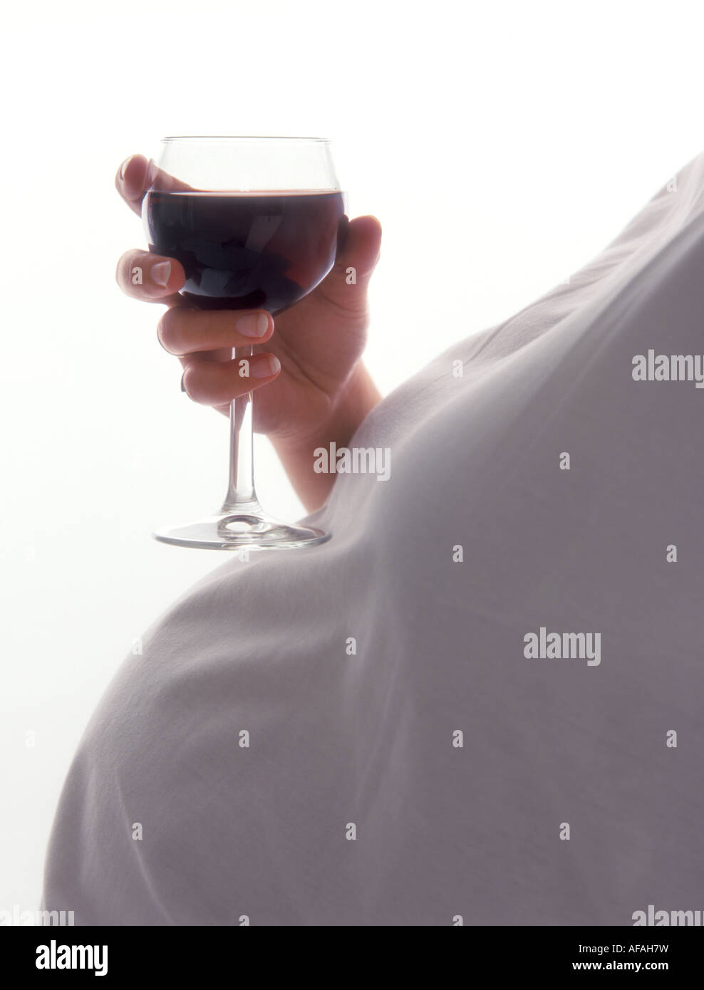 Pregnant belly with a glass of red wine Stock Photo - Alamy