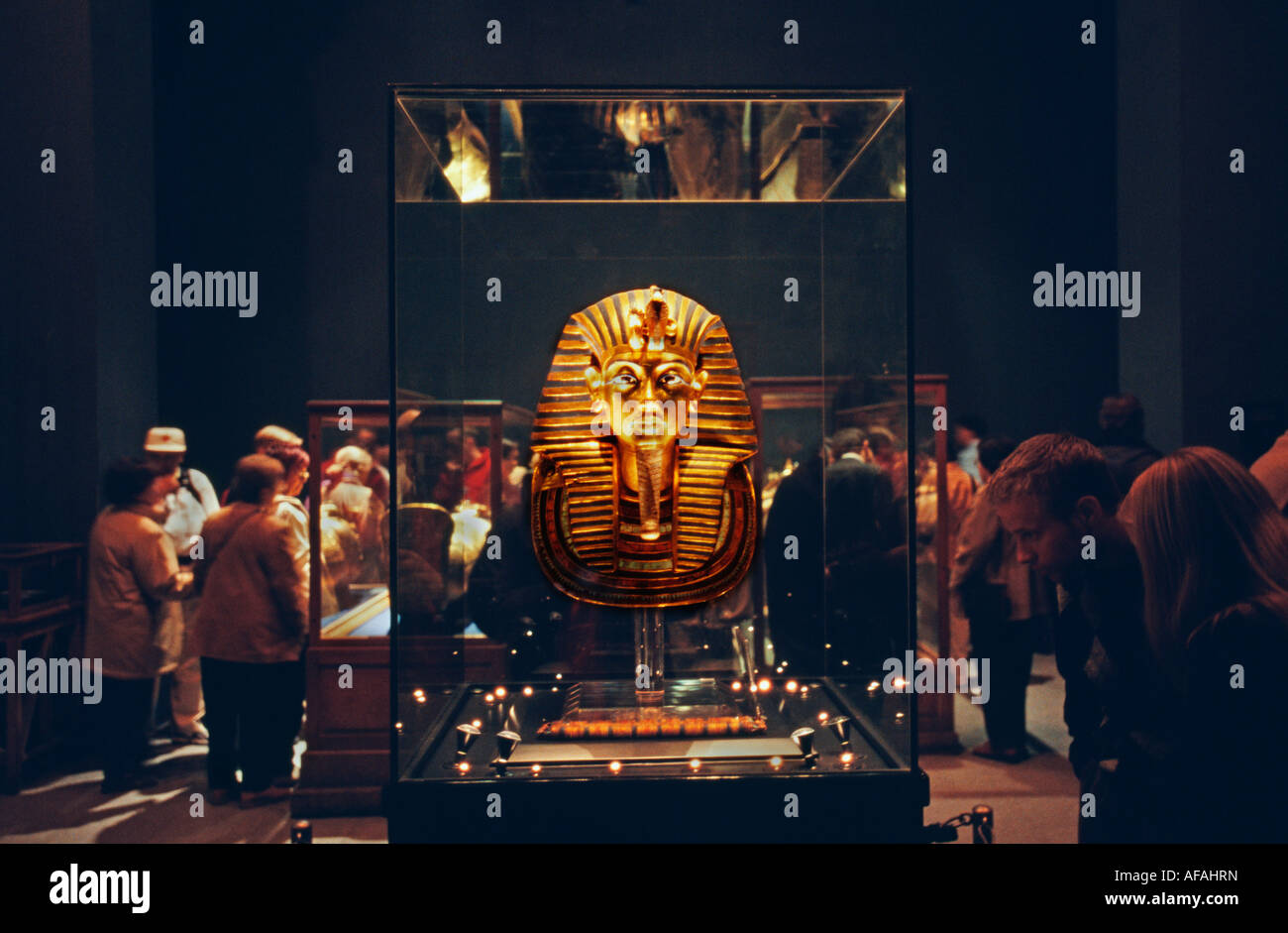 Egypt Cairo, People watching the golden funerary mask or death mask of ...