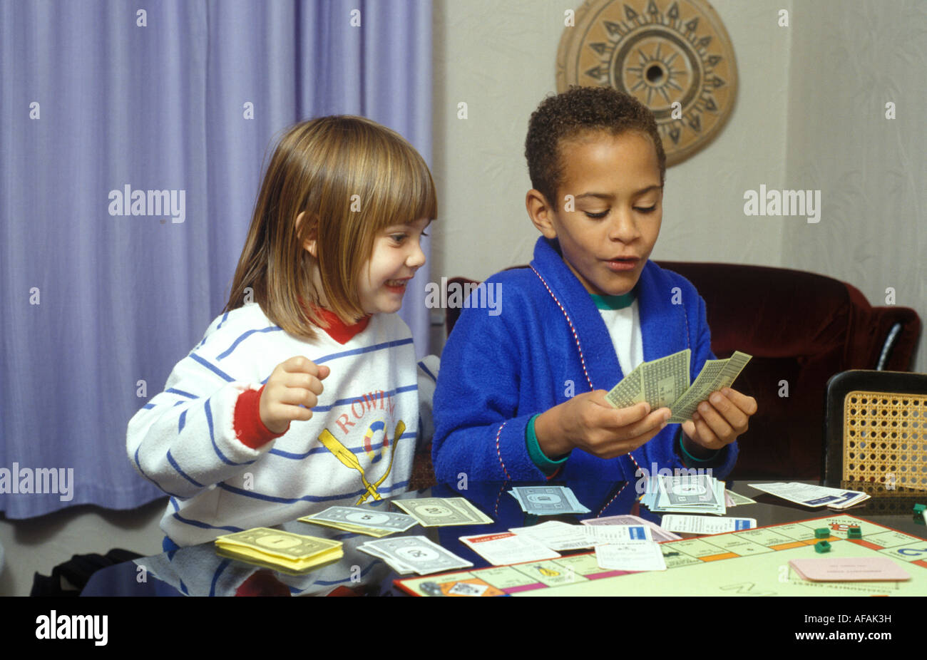children playing monopoly Stock Photo - Alamy