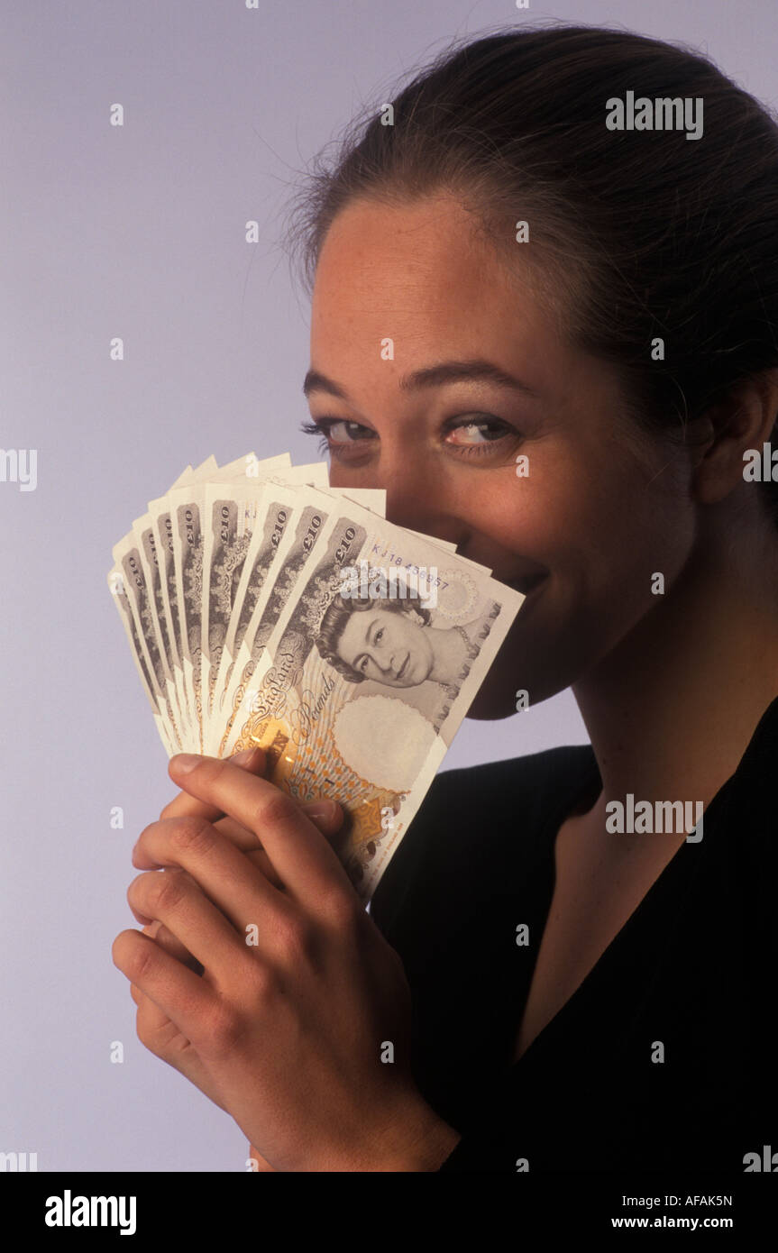 girl with fan of money Stock Photo - Alamy