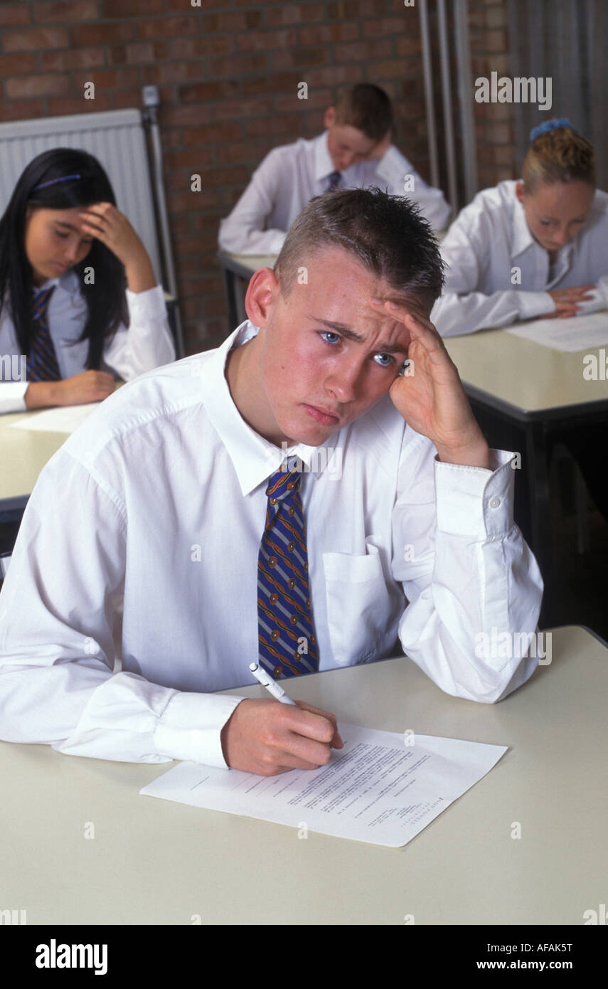 boy looking anxious while sitting an exam Stock Photo - Alamy