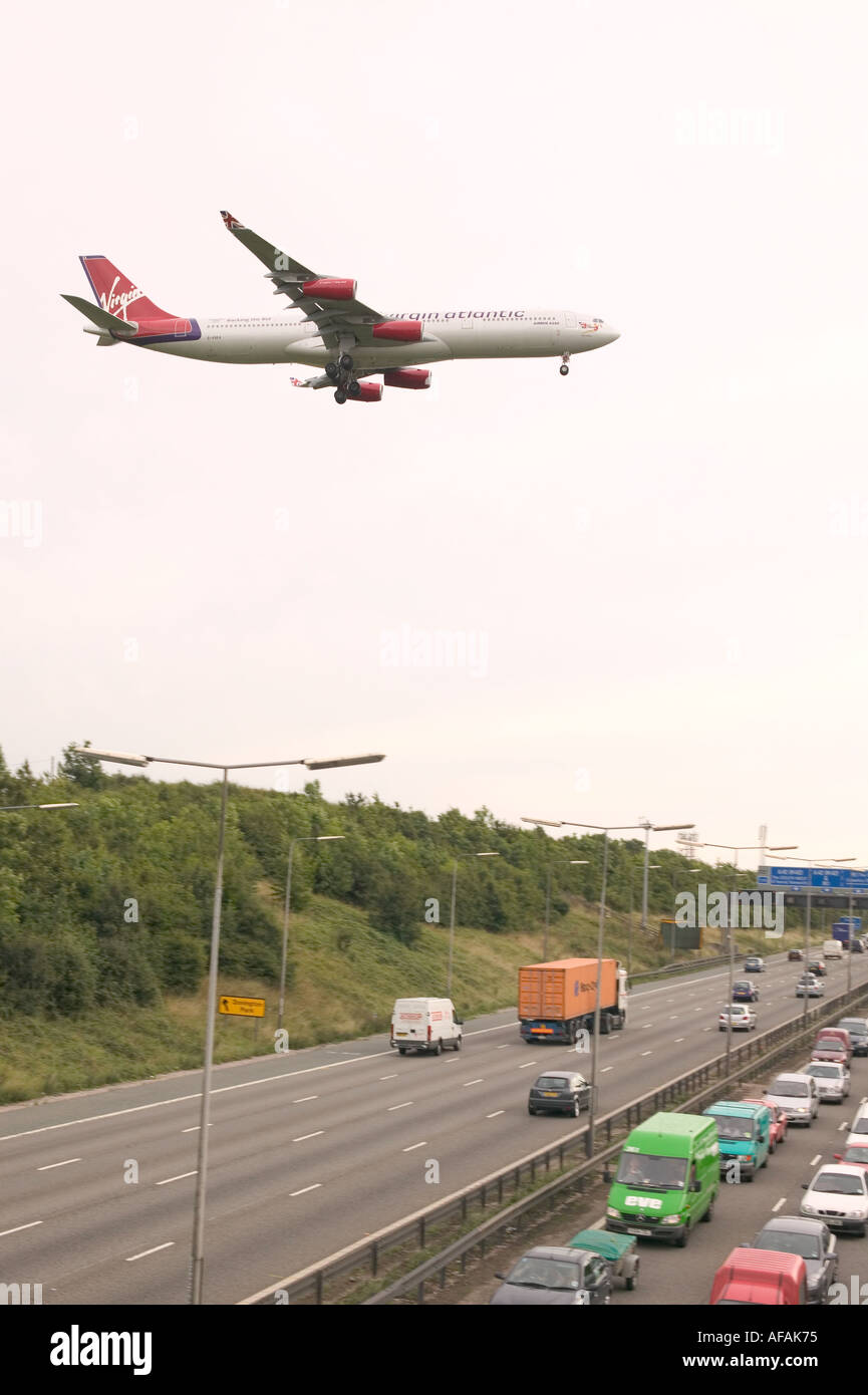 a plane coming in to land at East midlands airport flying low over a ...