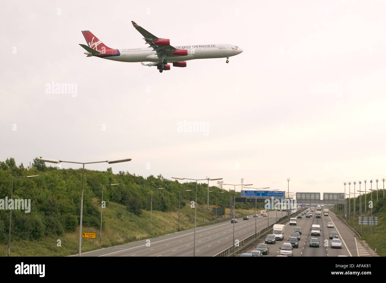 Plane flying over motorway hi-res stock photography and images - Alamy