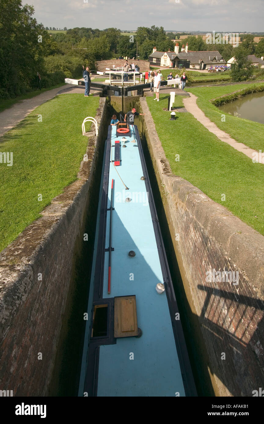 a narrow boat travelling through Foxton locks on the Grand Union Canal ...