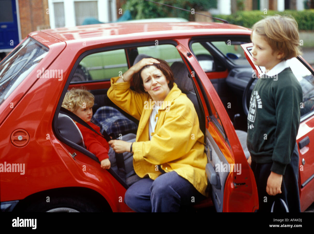 woman looking stressed on the school run Stock Photo - Alamy