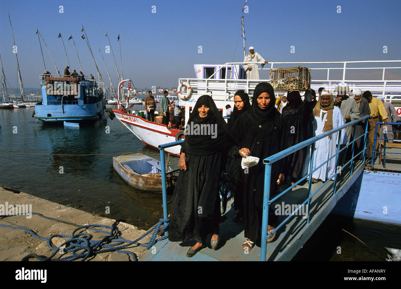 Egypt Luxor People disembarking from ferry in Nile river Stock Photo ...