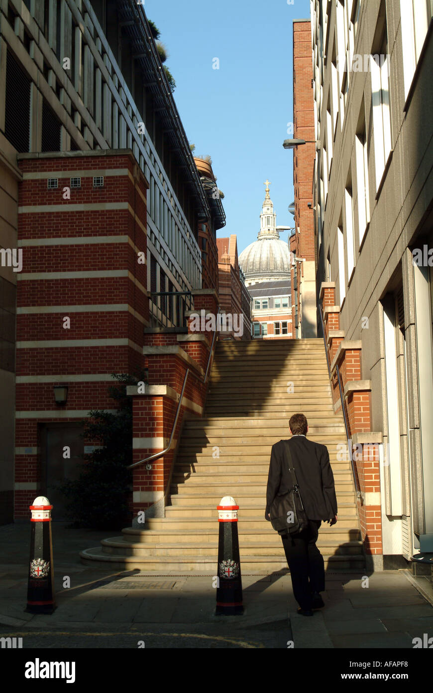 Modern steps and St Paul’s Cathedral with a businessman in the City of ...