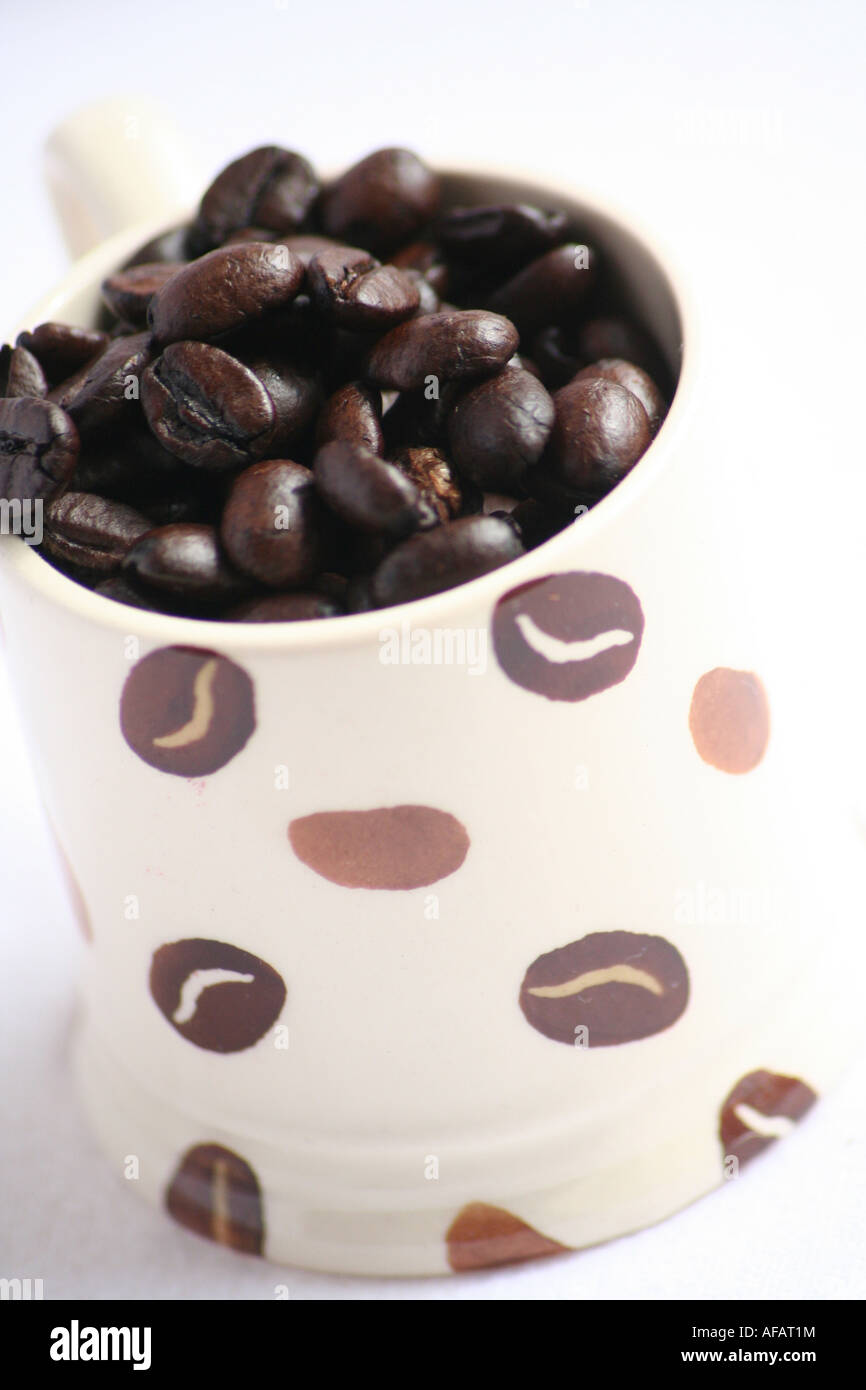 An Emma Bridgewater Espresso Cup Filled with Coffee Beans Stock Photo ...