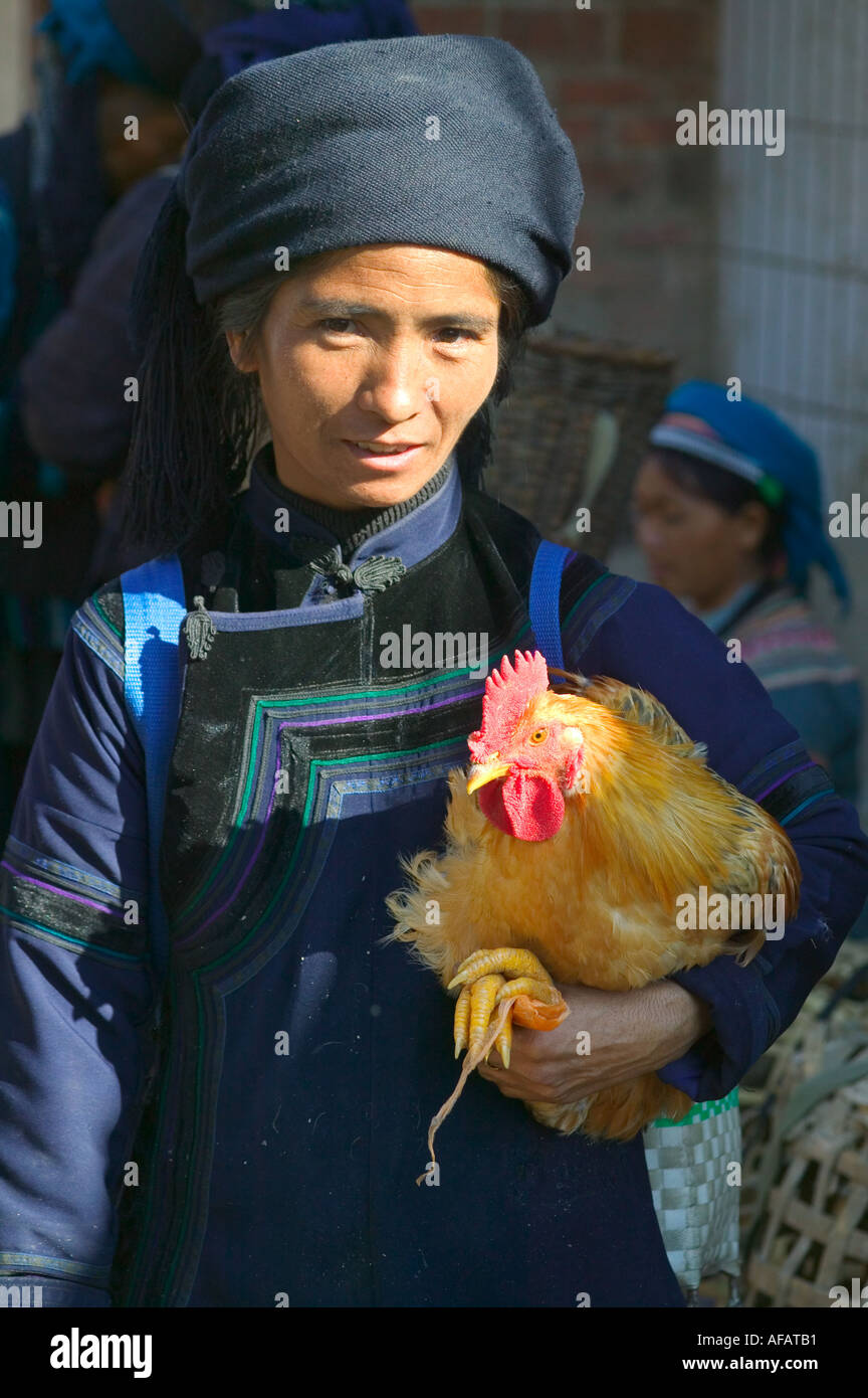 Woman carrying a chicken hi-res stock photography and images - Alamy