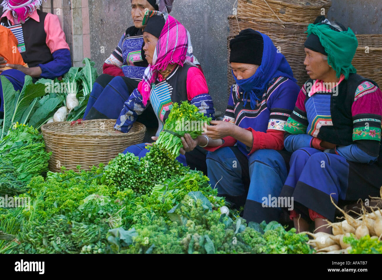 Hani people at local produce market Yunnan China Stock Photo - Alamy