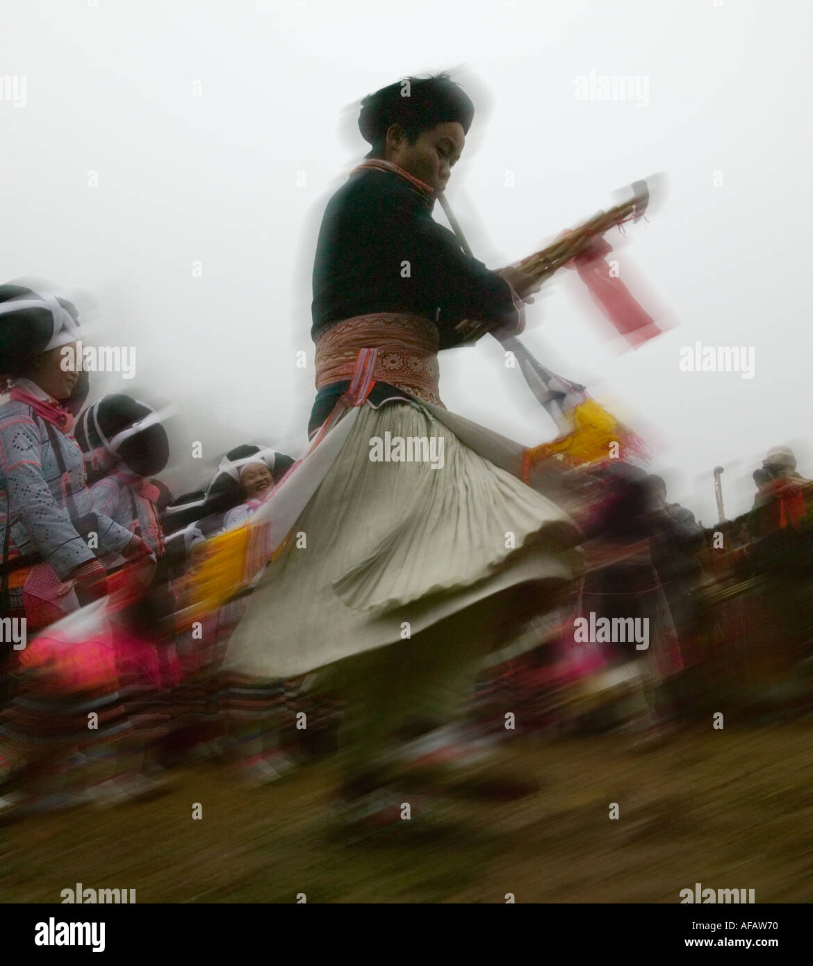 Long Horn Miao man blowing Lusheng traditional bamboo music instrument ...