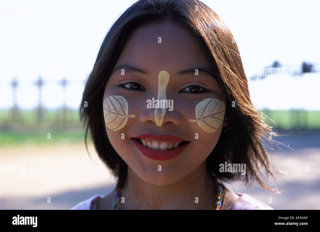 Mandalay portrait of girl with thanaka bark on her face Stock Photo - Alamy