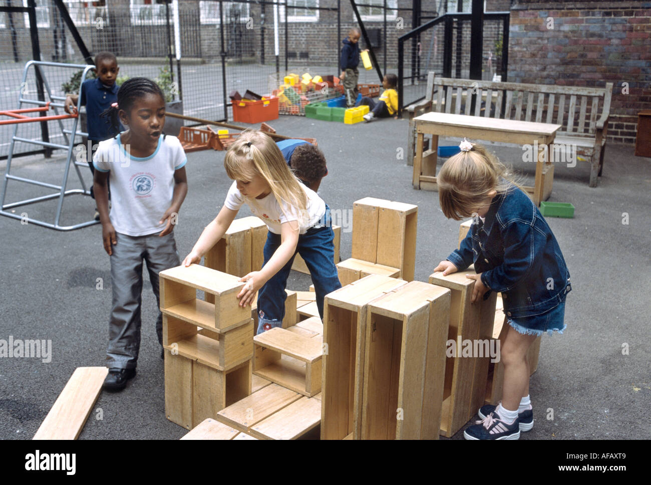 children from reception class playing in school playground Stock Photo ...