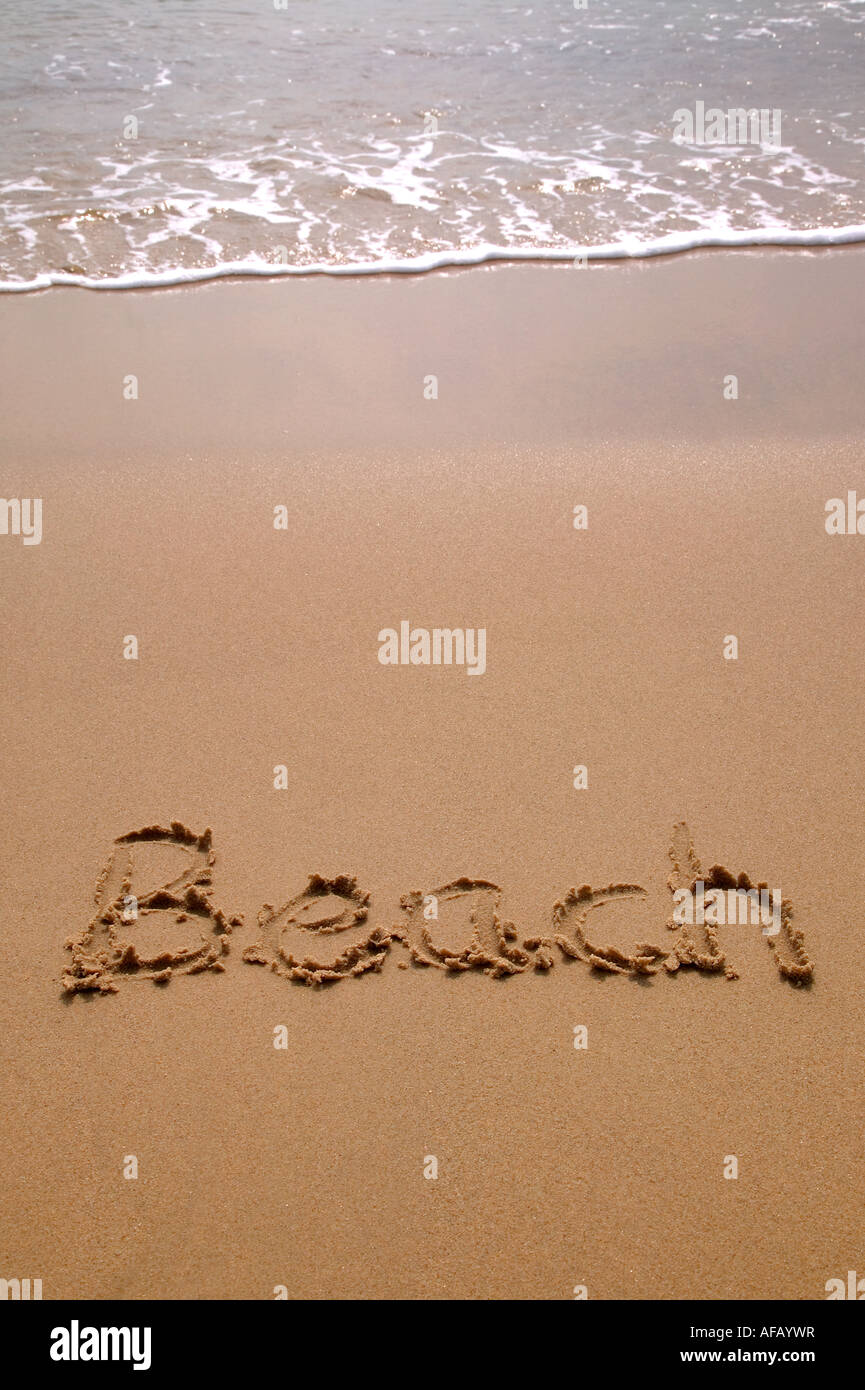 Beach written in sand at the beach Stock Photo - Alamy