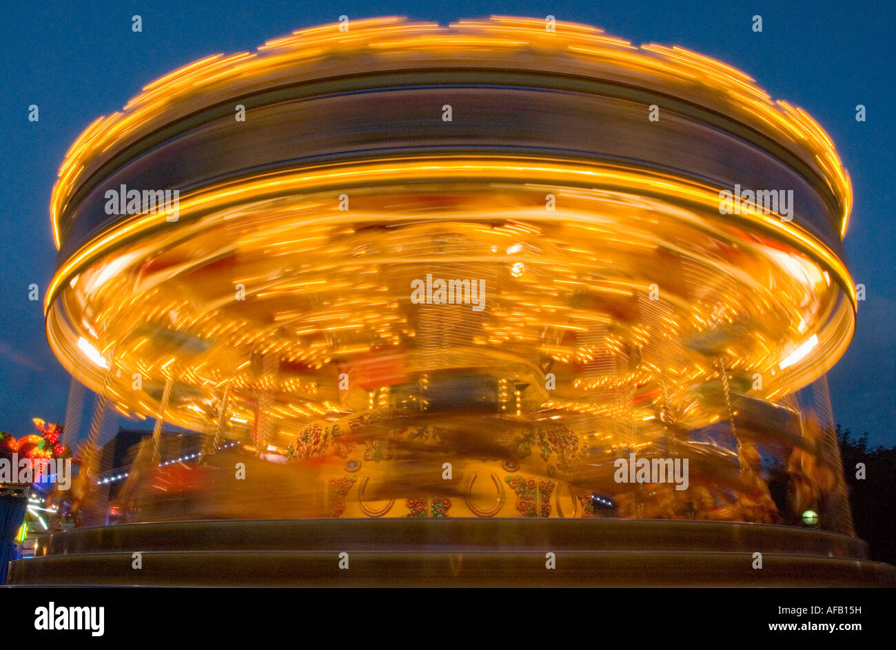 Fairground carousel ride at dusk Weymouth Dorset Stock Photo - Alamy
