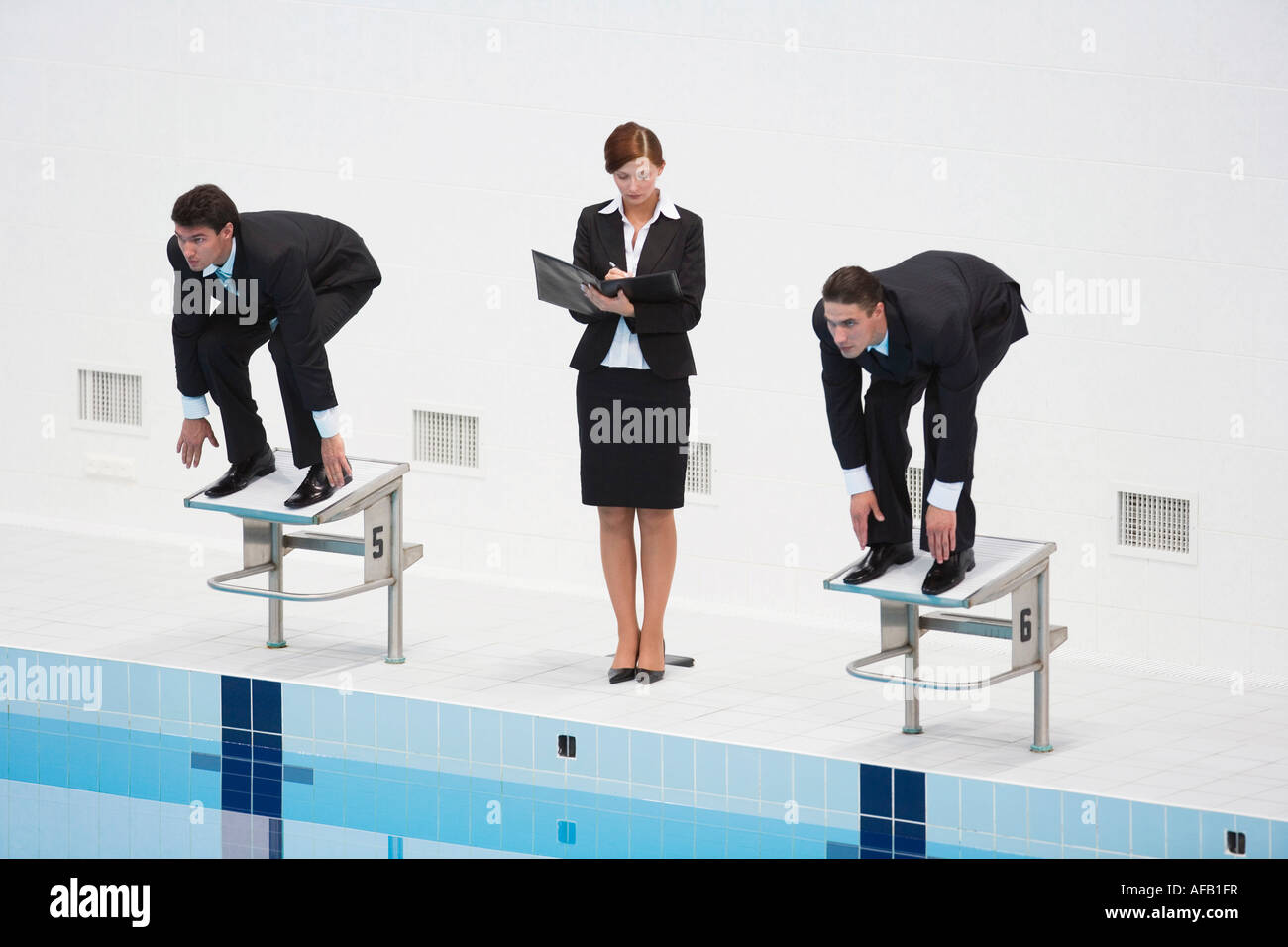 Starting blocks in suit hi-res stock photography and images - Alamy