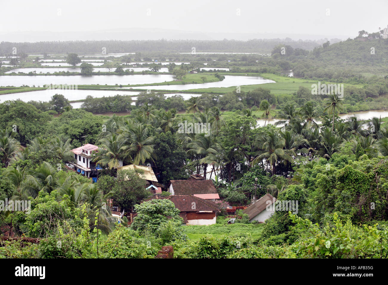 Batim village and background of prawn farms during monsoon used as salt ...