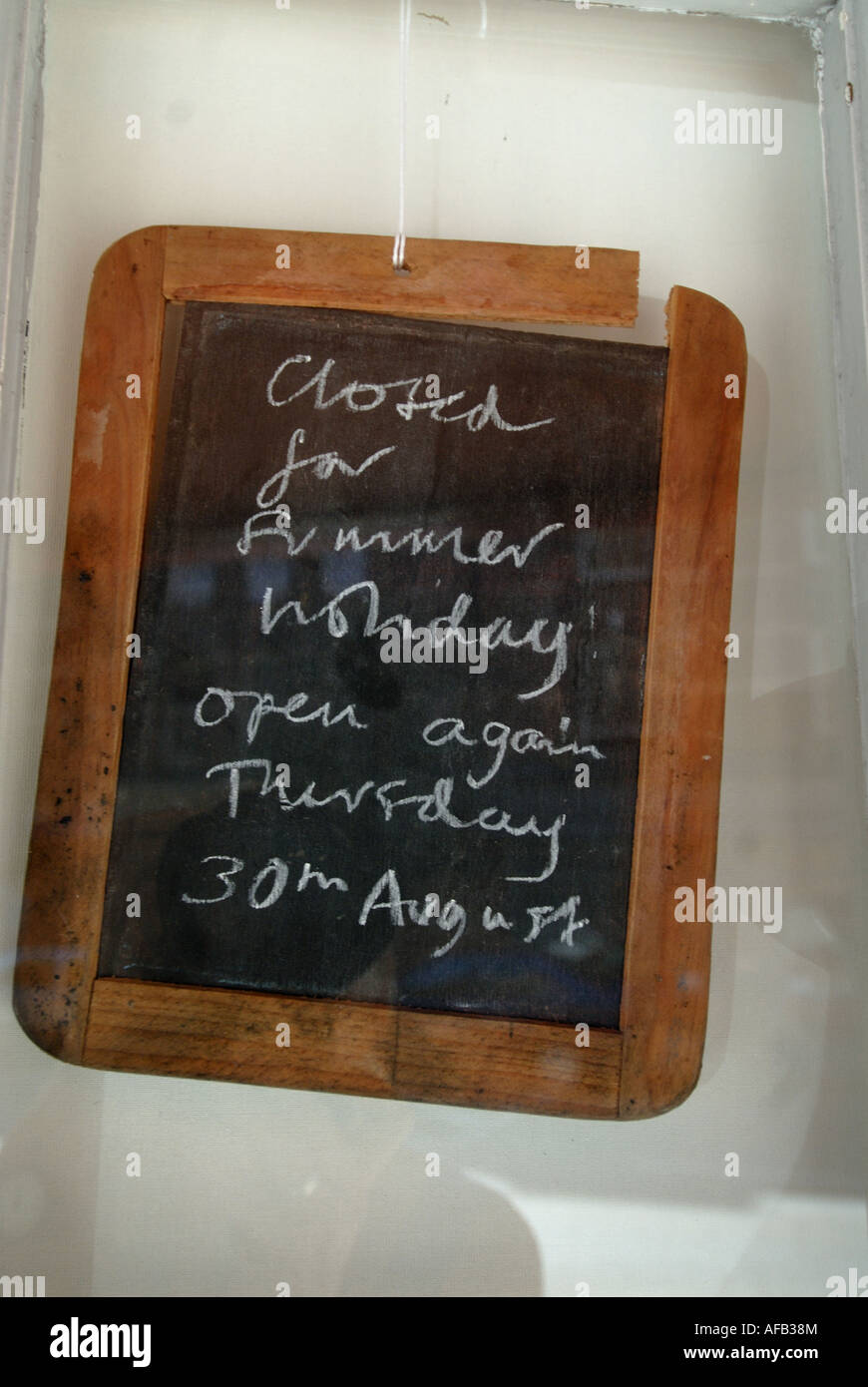 London.Delicatessen. Sign saying closed for summer holidays Stock Photo ...