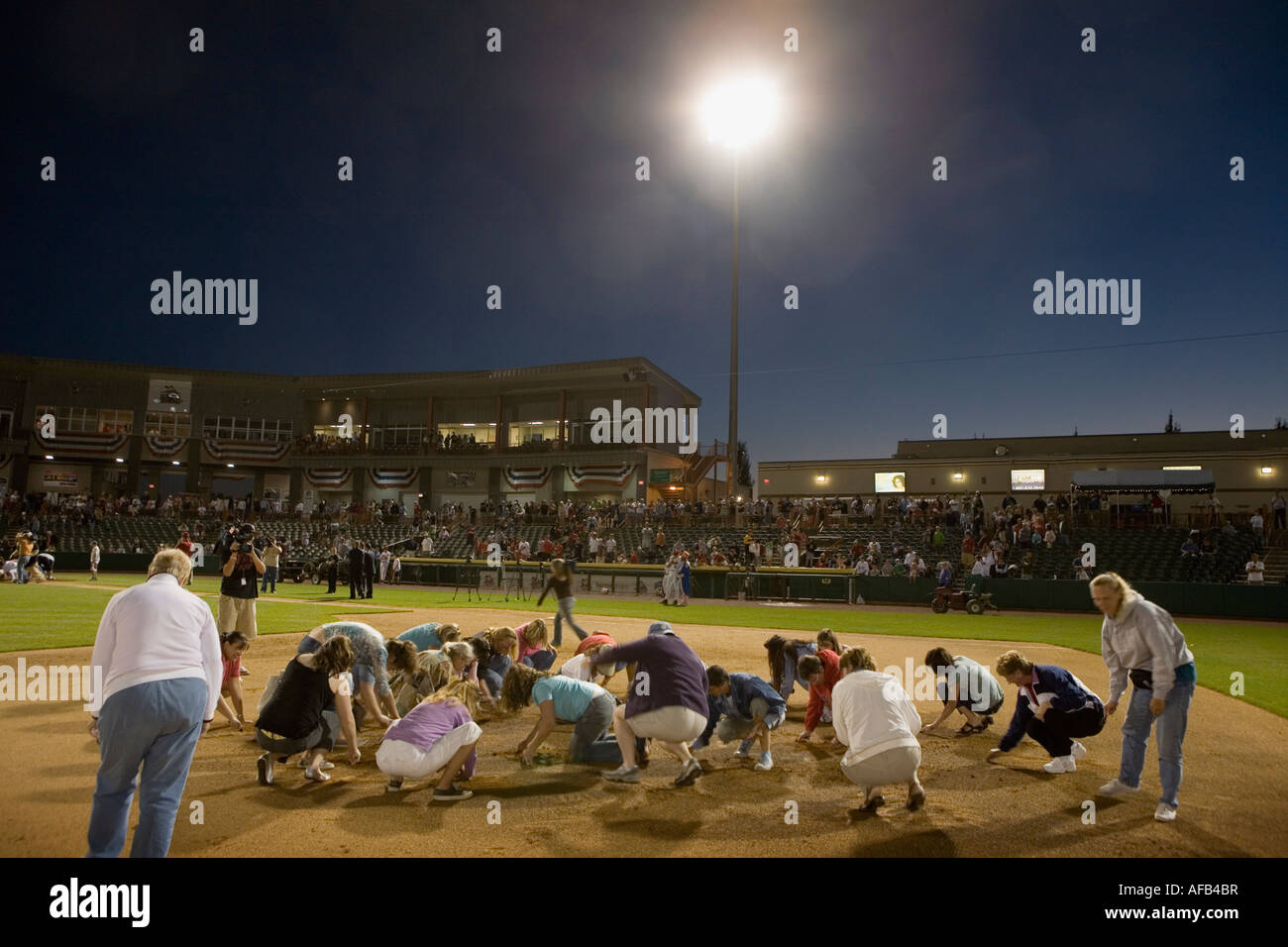 Women hunting for hidden diamond a promo at a minor league baseball ...