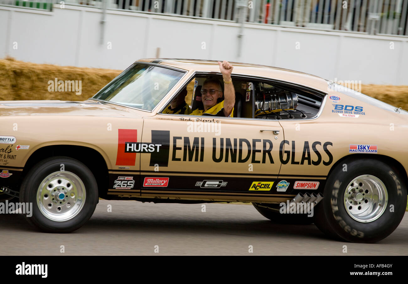 1968 Plymouth Barracuda, with Bob Riggle, makes its way to the start at ...