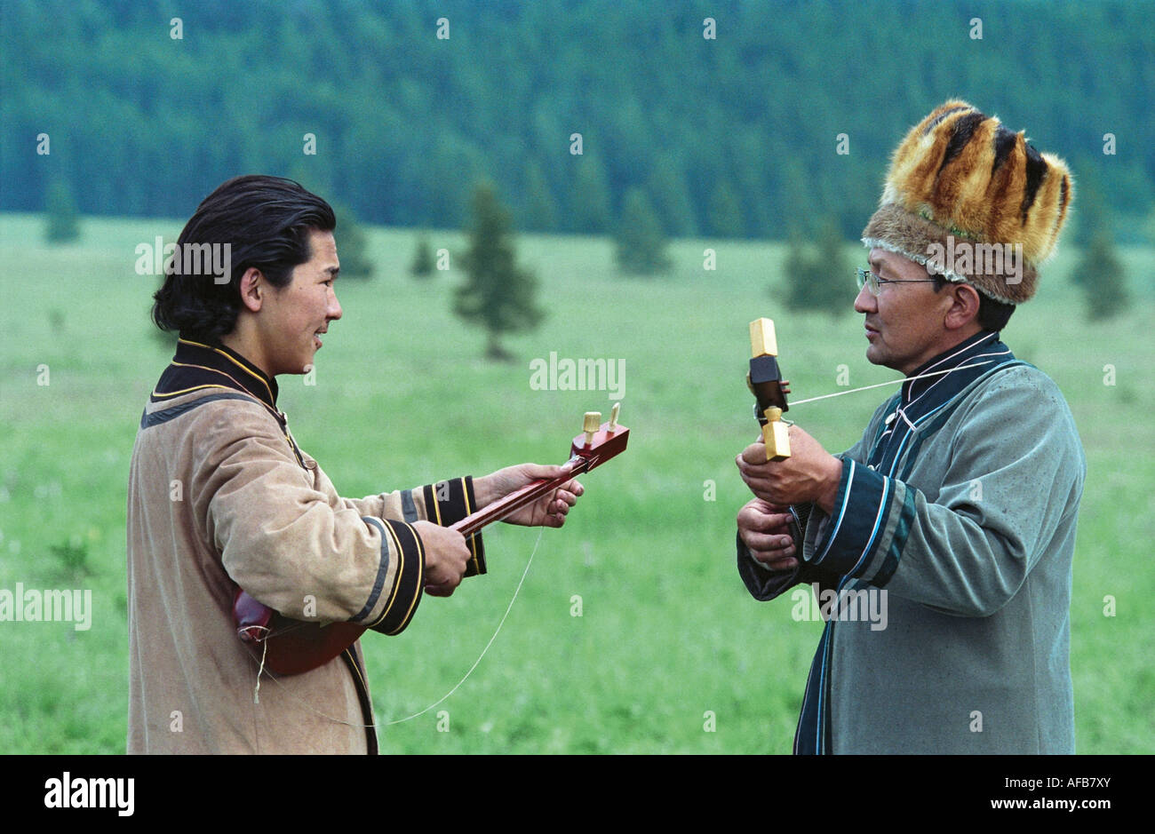 Portrait of men performing national Altaic epics and accompanied by the ...