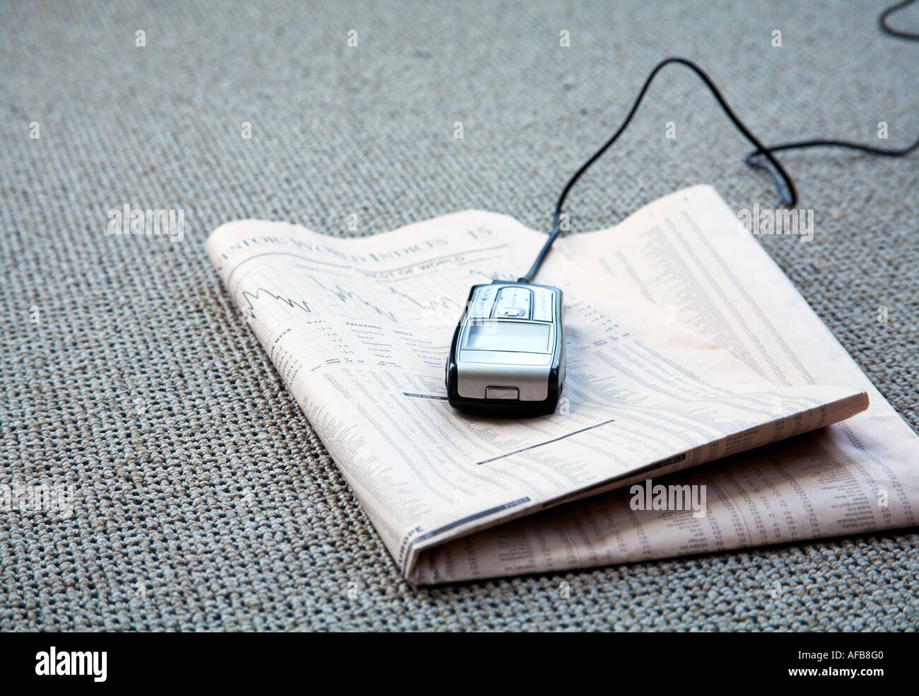 still life of mobile phone lying on business paper Stock Photo - Alamy