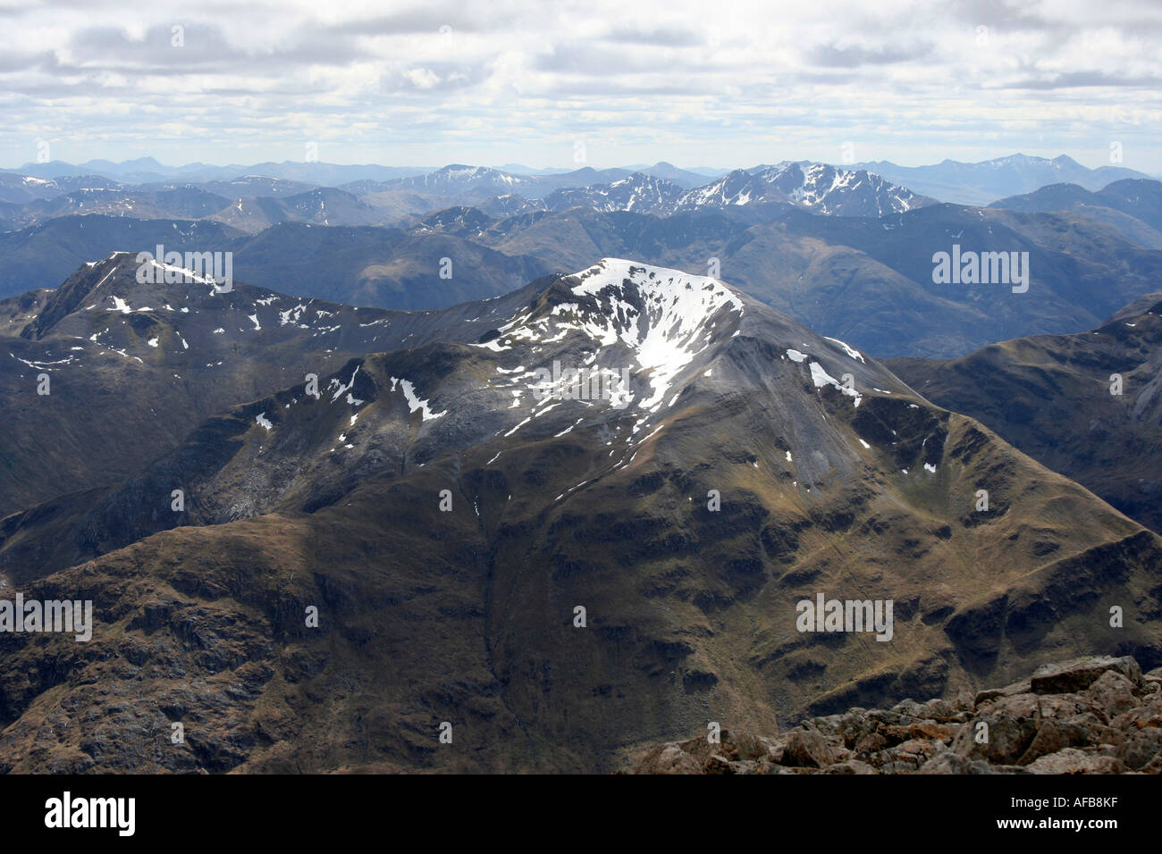 View from the top of Ben Nevis showing corrie formed mountain with some ...