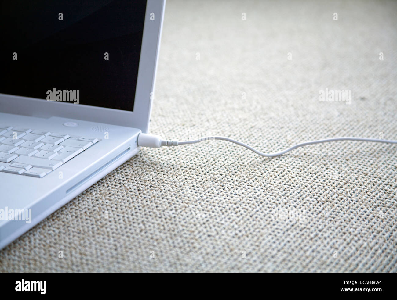 detail of laptop computer and cable Stock Photo - Alamy
