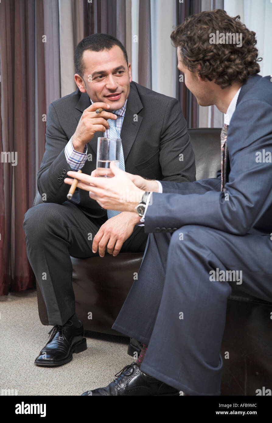 Two men cigars smoking hi-res stock photography and images - Alamy