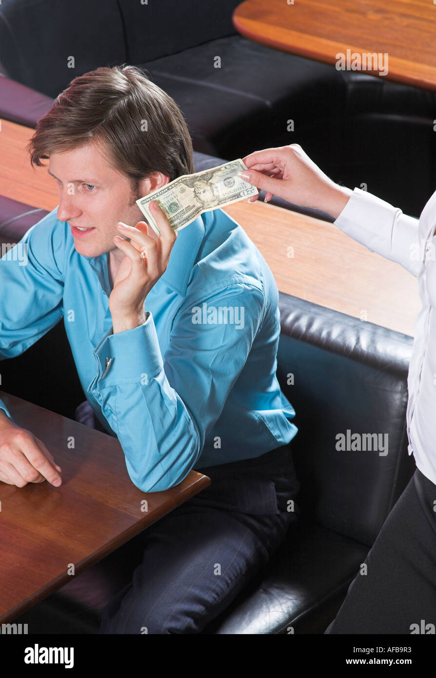 Business women paying for lunch hi-res stock photography and images - Alamy