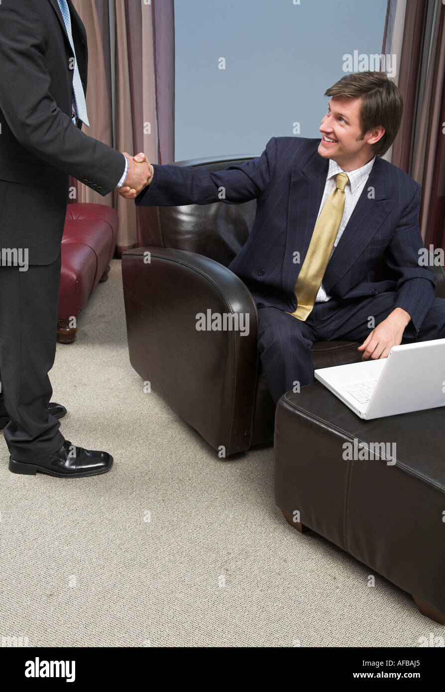 Two computers shaking hands hi-res stock photography and images - Alamy