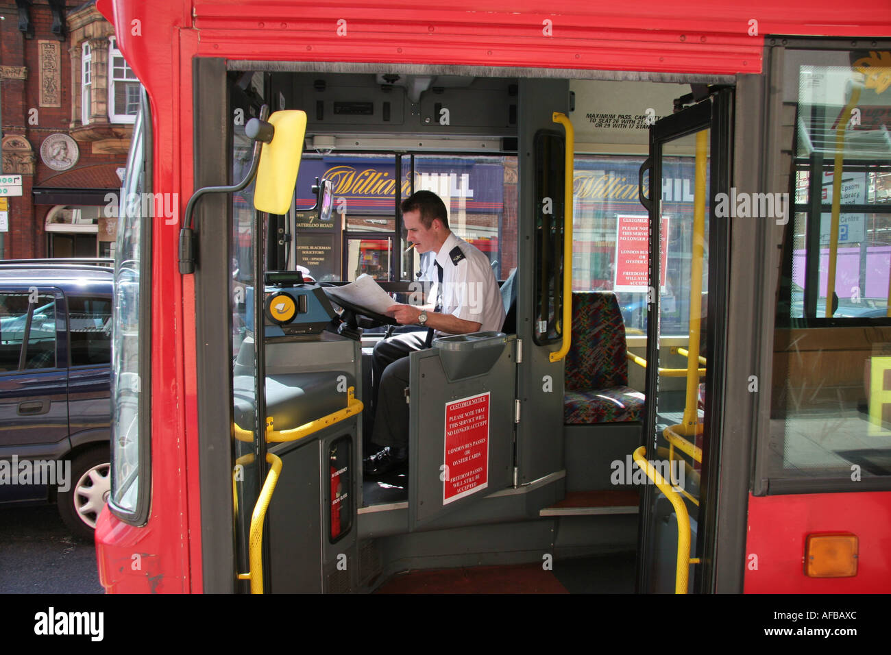 bus driver checking paperwork Stock Photo - Alamy