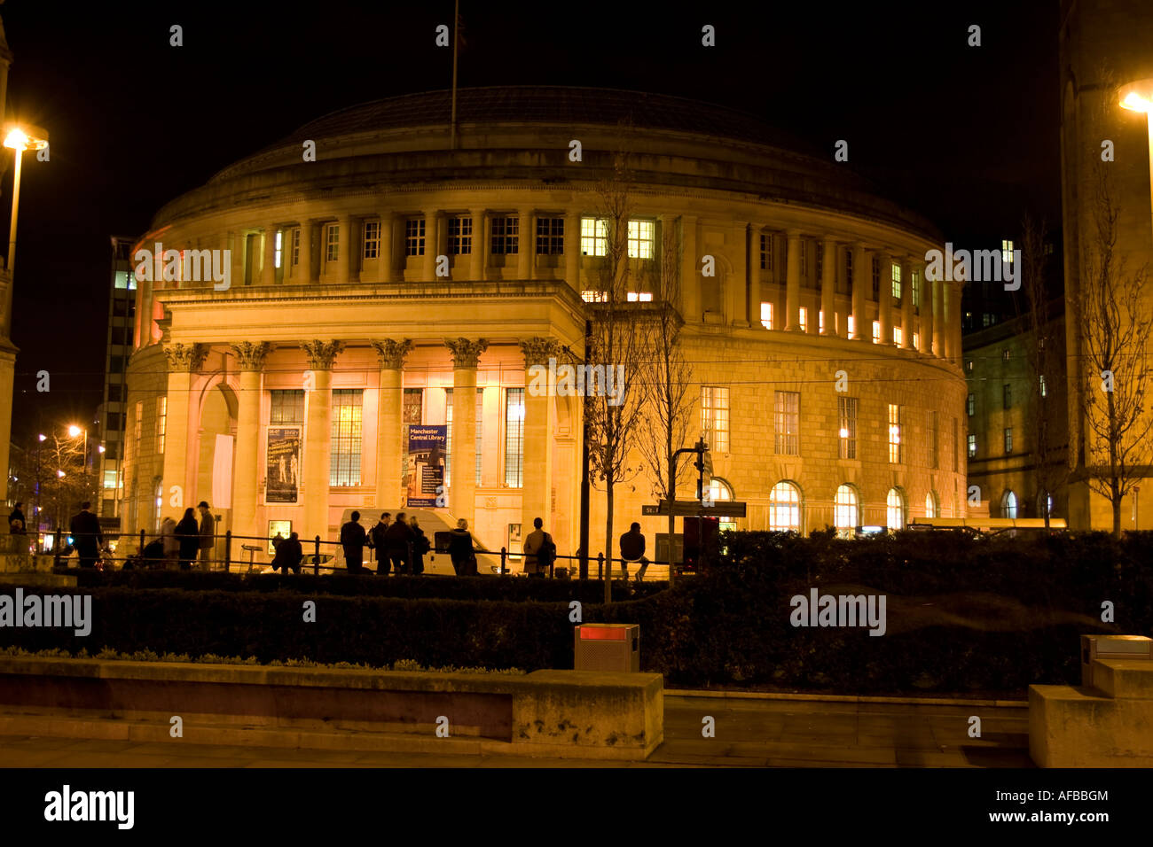 Central Library at night with commuters waiting at tram stop Stock ...