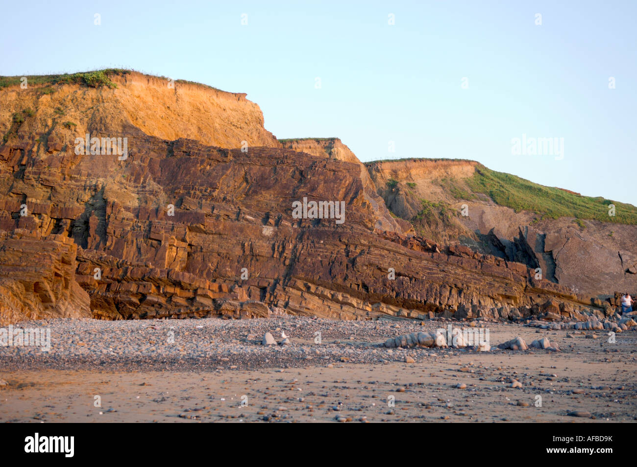 Cliffs showing inclined geological strata Northcott Mouth beach North ...