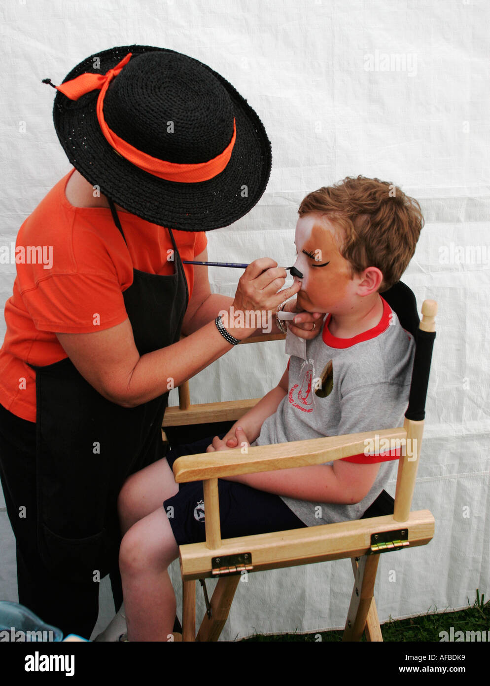 Young boy getting his painted at a festival Stock Photo - Alamy