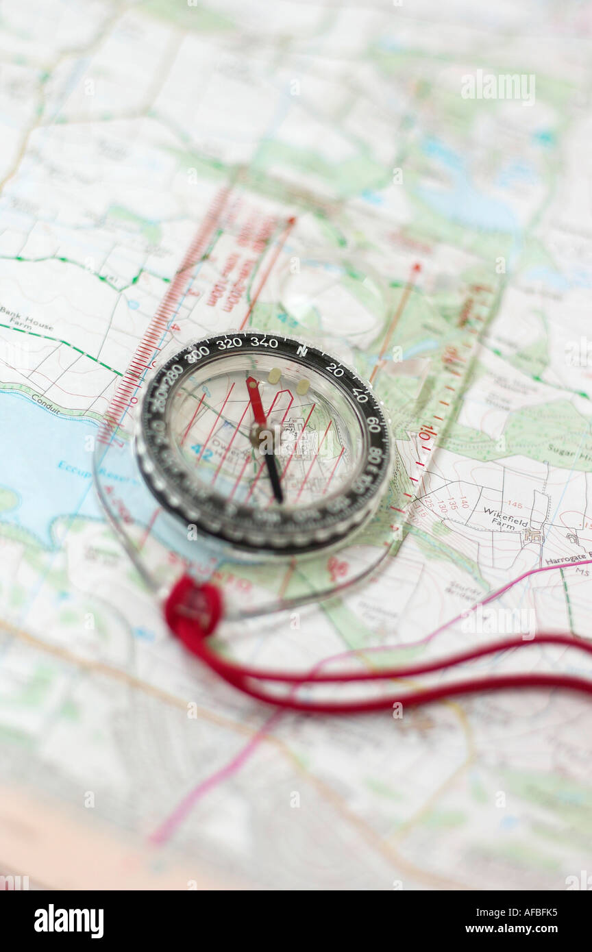 Compass on Map Stock Photo - Alamy