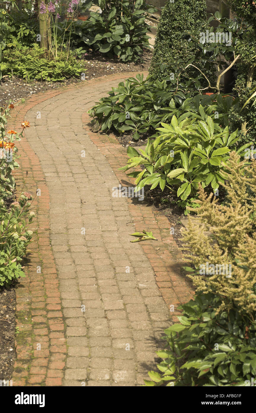Rustic garden path with well planted border UK August Stock Photo - Alamy