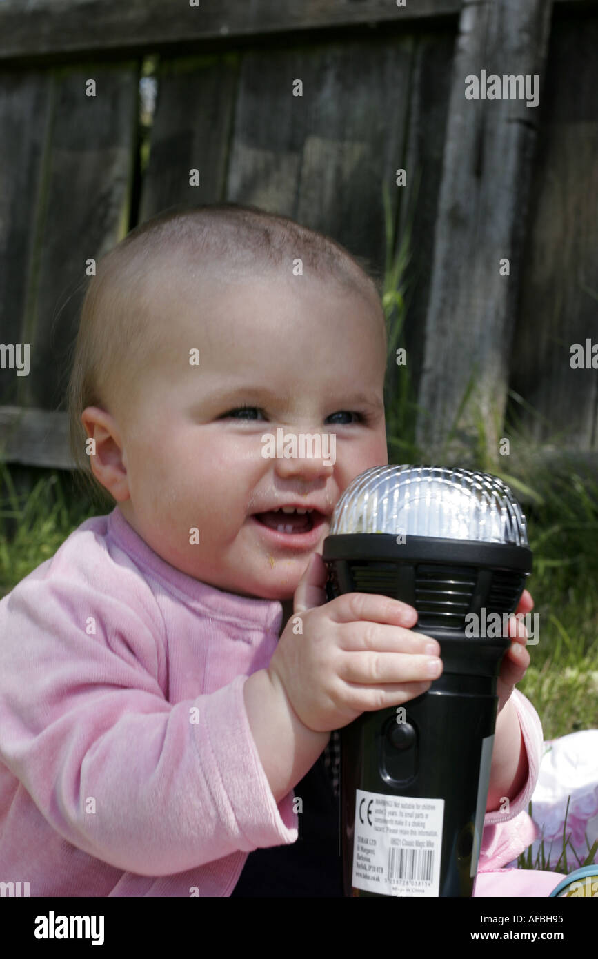 Child singing outside microphone hi-res stock photography and images ...