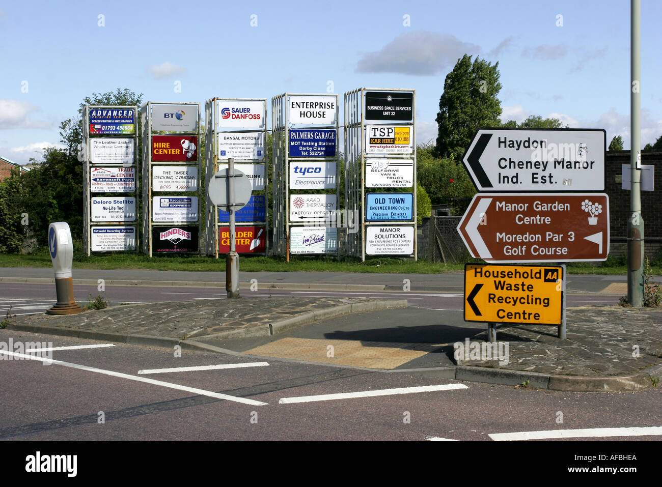 Clutter of signs outside an industrial estate in Swindon Stock Photo ...