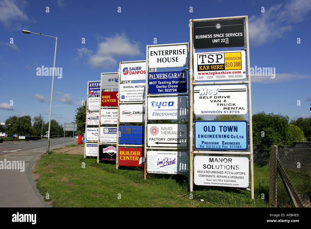 Clutter of signs outside an industrial estate in Swindon Stock Photo ...